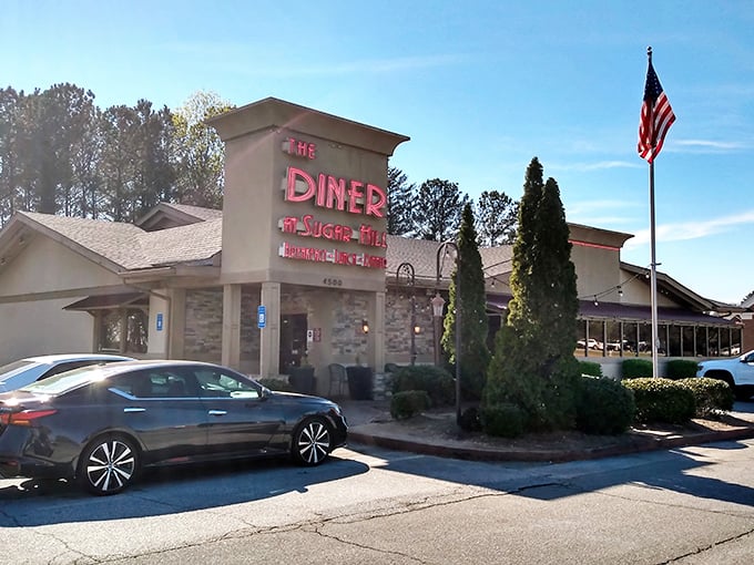 The iconic red neon sign beckons hungry travelers like a lighthouse for the famished. Home cooking awaits behind those doors.