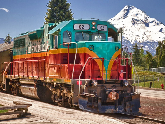 That's not just any locomotive – it's a rolling piece of Americana with Mount Hood providing the perfect backdrop.