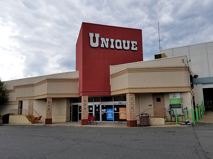 The iconic red tower of Unique Thrift Store stands like a beacon for bargain hunters, promising treasures within its massive walls.