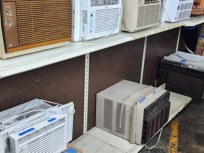 The air conditioner graveyard—where cooling units go for their second chance at bringing comfort to sweltering Midwestern summers.