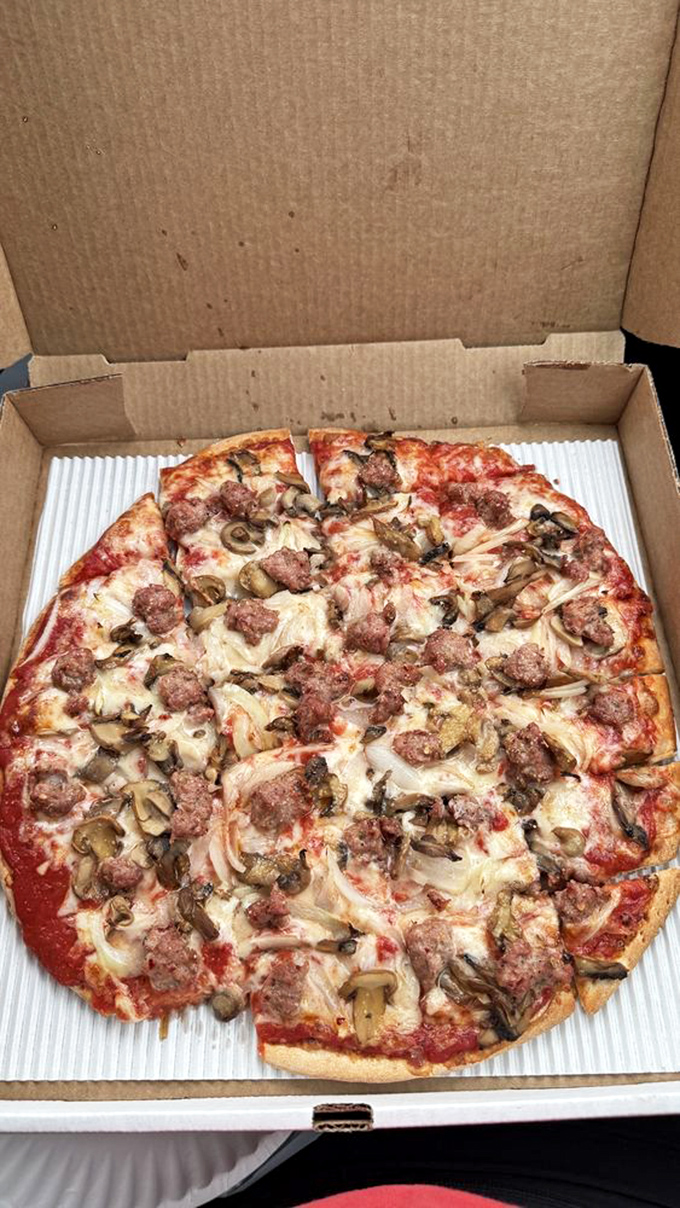 A masterclass in meat arrangement—this pizza doesn't just satisfy hunger, it conquers it with a battalion of perfectly cooked toppings.