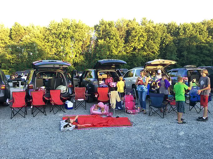 Tailgating reimagined: families transform their SUVs into cozy viewing nests complete with chairs, blankets, and community spirit.