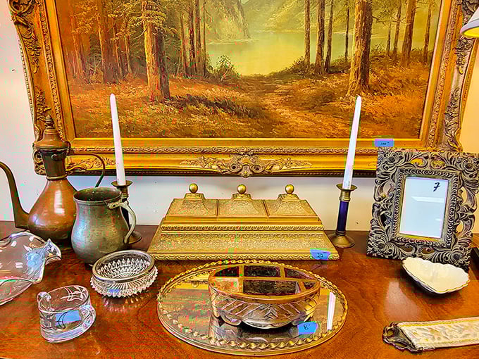 Antique treasures arranged with gallery-worthy precision. That forest painting has probably witnessed more dinner conversations than most therapists.