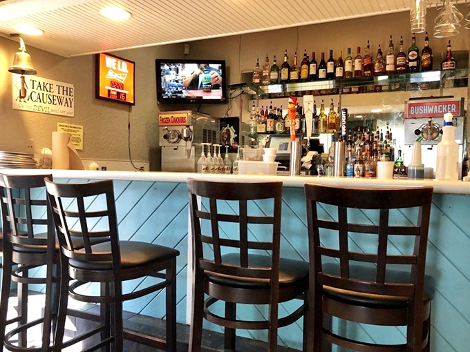 The bar where "I'll just have one drink" turns into three hours of making new friends. Blue paneling and cold beer—the perfect seafood accompaniment.