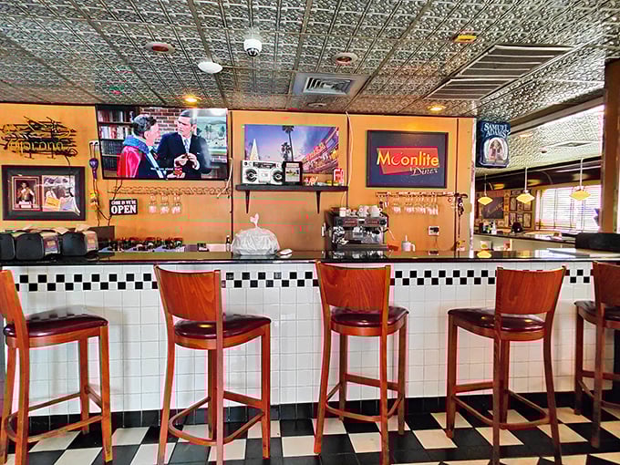 Pull up a stool at the counter bar where the checkered pattern continues and vintage signs remind you that some things never go out of style.