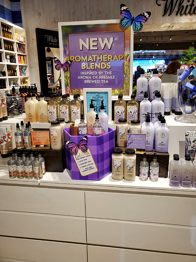 Bath & Body Works' aromatherapy display – where butterfly decorations and purple packaging promise to transform your shower into a spa retreat.