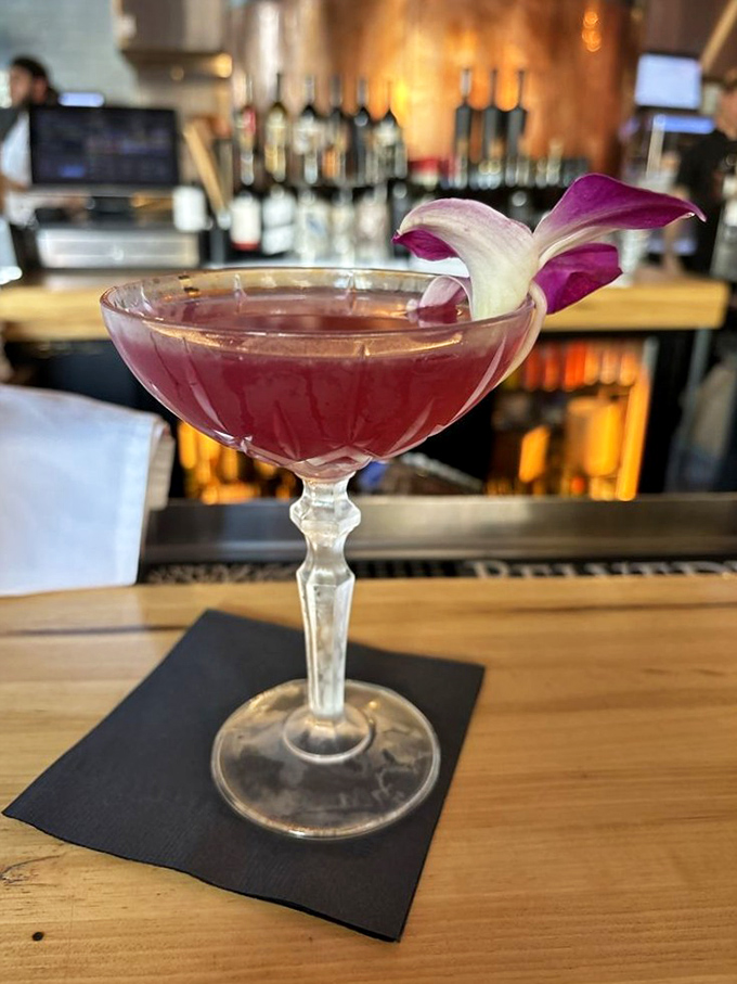 A cocktail that's dressed better than most people at the Oscars. That orchid garnish isn't just showing off—it's setting the stage for the flavor performance to come.
