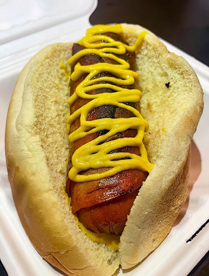 The Bmore Dog comes dressed for success with a mustard drizzle that's applied with the precision of a Jackson Pollock painting.