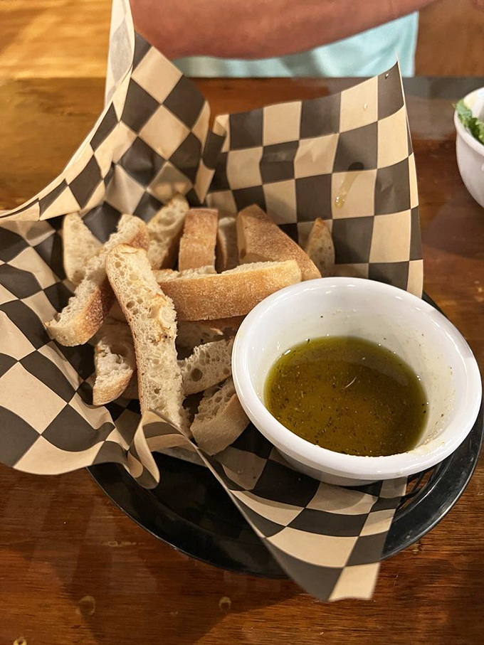 Bread and olive oil—civilization's greatest achievement. This basket of carb-loaded joy is the Mediterranean equivalent of "hello, beautiful."