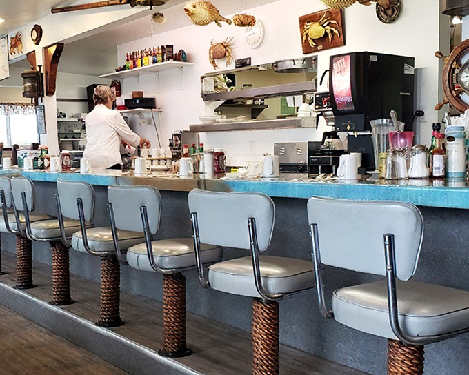 The breakfast counter – where morning philosophers gather to solve the world's problems over coffee and the promise of fresh seafood omelets.