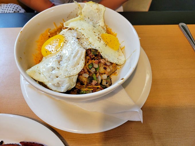 A breakfast bowl that means business—perfectly fried eggs atop a mountain of savory goodness. The kind of meal that powers you through until dinner.