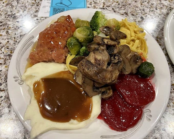 The ultimate buffet strategy on display: a little of everything, arranged with the precision of a Renaissance painting.