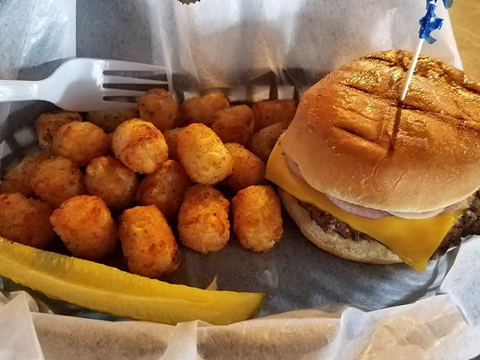 This isn't a burger that's trying to reinvent the wheel—it's just executing the classics perfectly, with those golden tots standing by for moral support.