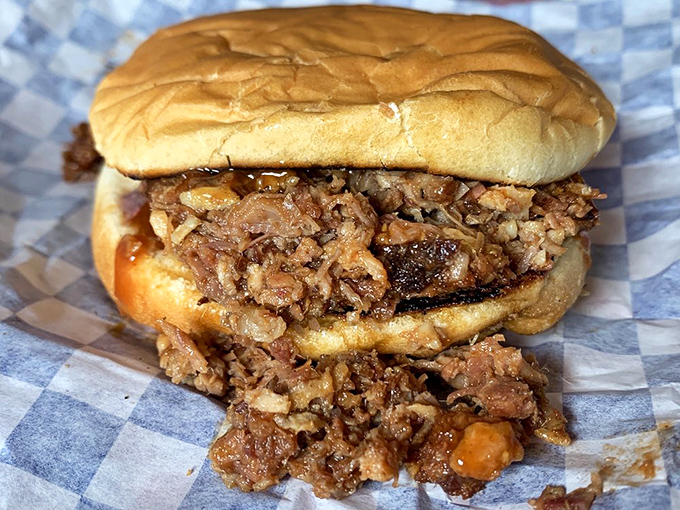 This isn't just a chopped beef sandwich—it's a masterpiece of texture and flavor that requires both napkins and your complete attention.
