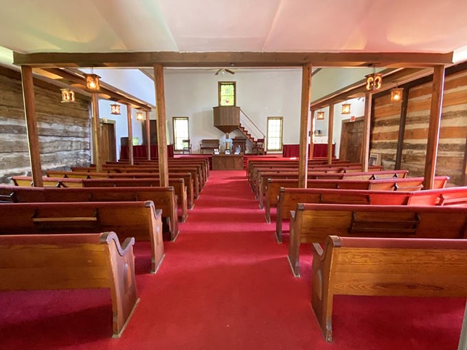 Simple wooden pews and a central pulpit remind us that sometimes, the most profound messages need the least technological assistance.