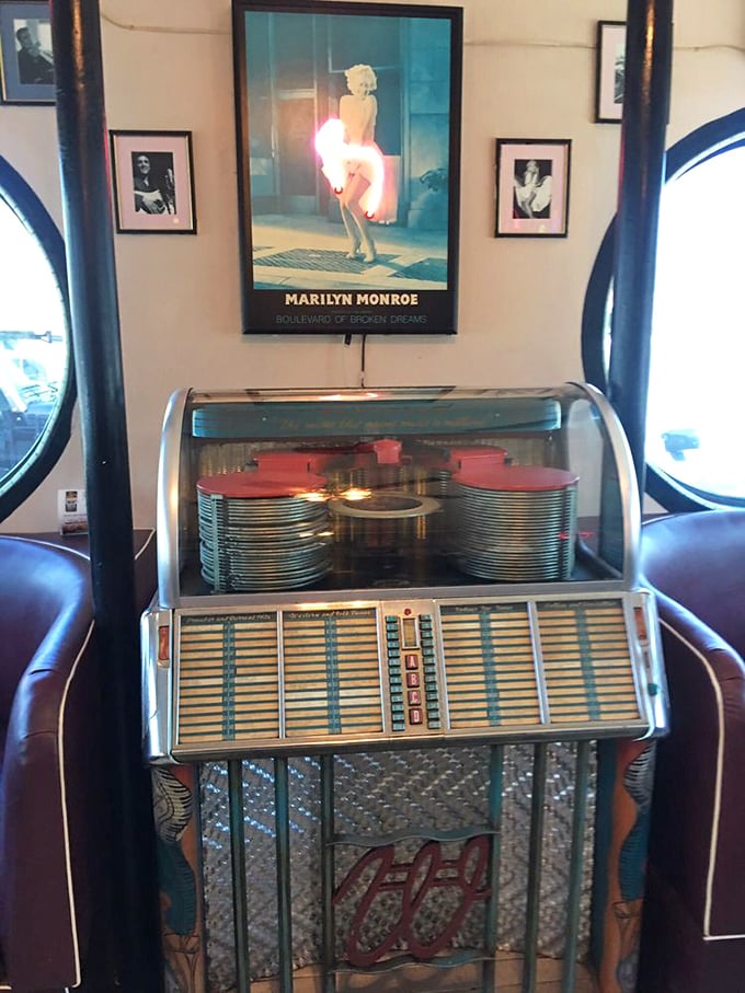 A classic jukebox stands sentinel beneath Marilyn's watchful gaze—two American icons keeping the nostalgic vibes flowing.