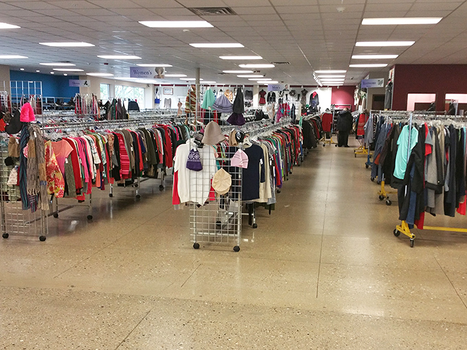 The clothing forest—where racks create pathways through fashion history and every hanger holds the potential for style reinvention.