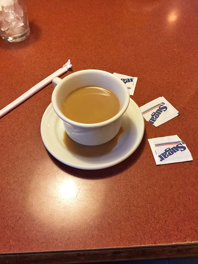 The humble coffee cup—civilization's greatest achievement and the unsung hero of every successful breakfast outing.