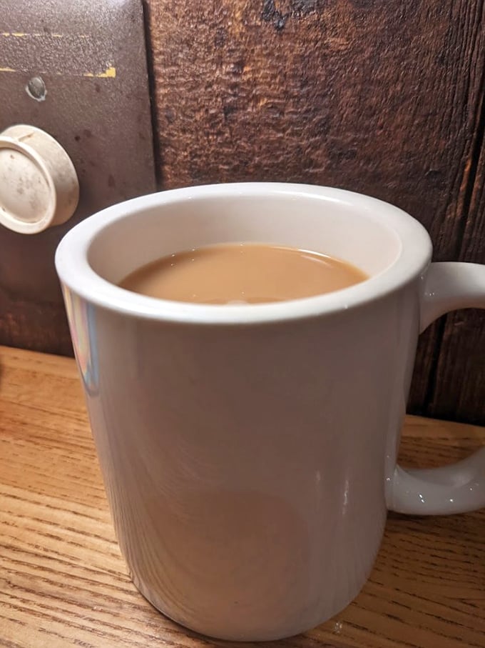 The humble coffee mug – steadfast companion to countless conversations, deal-makings, and dessert deliberations within these wooden walls.