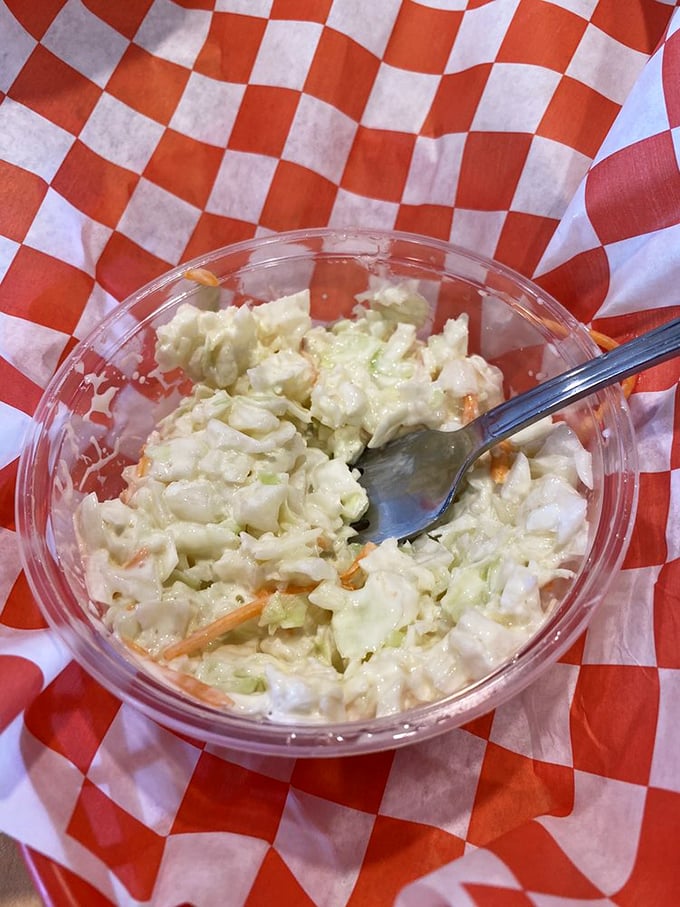 Creamy, crunchy cabbage perfection. This isn't your bland afterthought coleslaw—it's a worthy companion to the main event, bright and fresh with just the right amount of dressing.