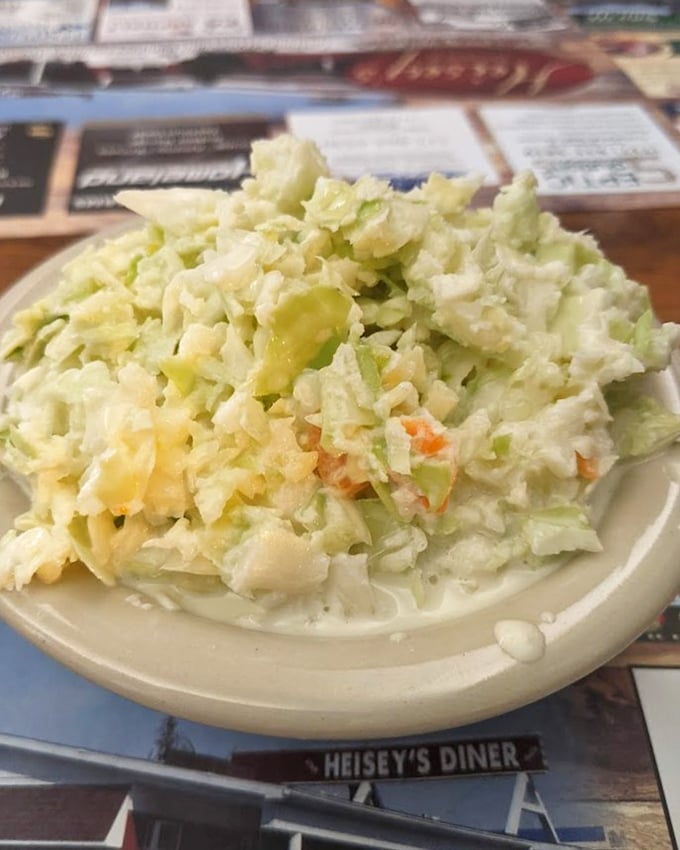 Coleslaw that actually deserves its place on the plate. This isn't sad cafeteria filler—it's crisp, fresh vegetable confetti celebrating your good taste.