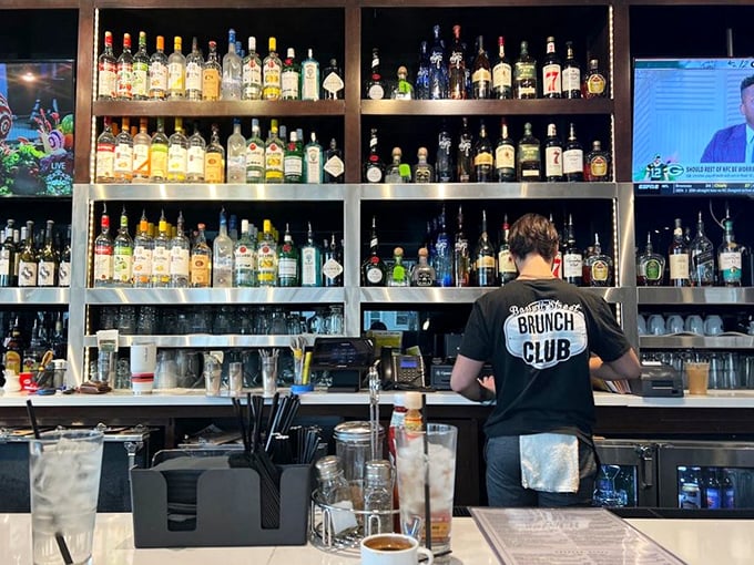 Behind that impressive bar lies liquid happiness in many forms. The staff shirts say it all – they're serious about this brunch business.