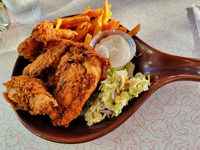 Fried chicken that's actually worth unbuttoning your pants for—crispy, golden-brown pieces that Colonel Sanders would salute with respect.