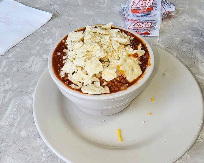 This isn't just chili—it's a warm hug in a bowl, topped with crackers and cheese. Comfort food that speaks a universal language.