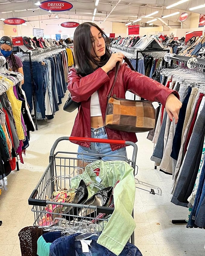 The thrill of the hunt captured in one perfect moment. This savvy shopper's cart already holds tomorrow's vintage treasures and today's practical finds.
