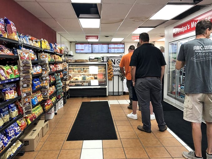 The line forms for good reason. These customers know that patience is rewarded with sandwich perfection—a universal truth at beloved local institutions.