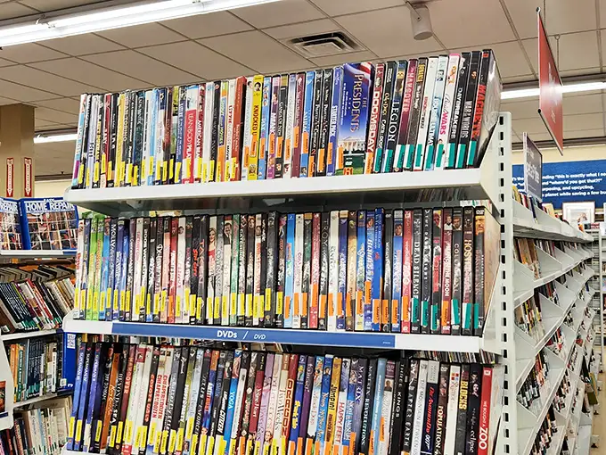 The DVD wall—a physical Netflix from the before times—where forgotten sequels and impulse purchases find their second act.