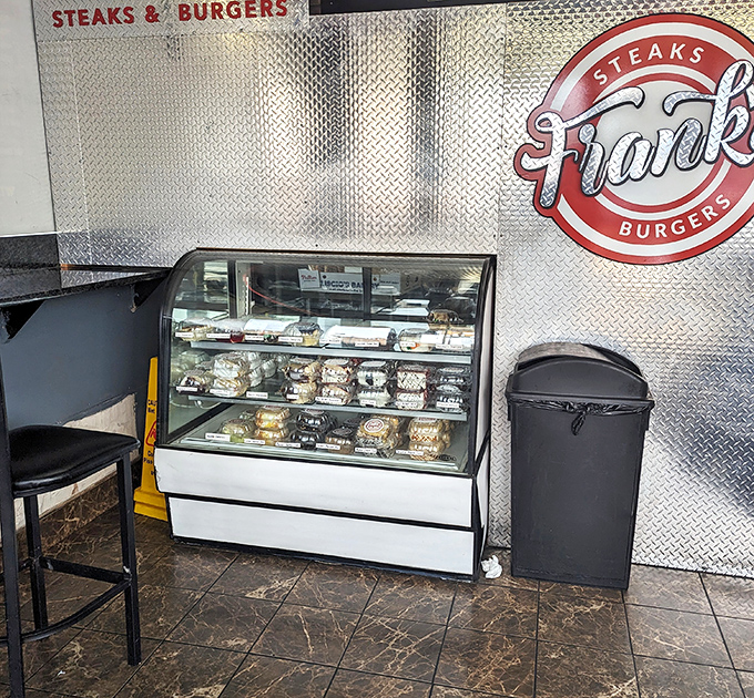 The dessert case – where willpower goes to die and "I'll just have a bite" becomes the lie you tell yourself.