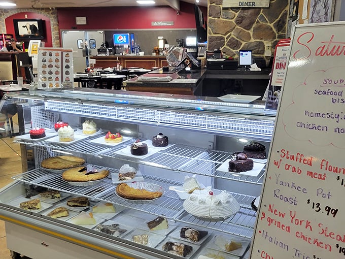 The dessert case—where willpower goes to die. Each pie and cake stands tall, silently judging your "I'll just have coffee" declaration.