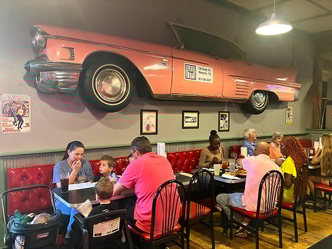 That vintage pink Cadillac on the wall isn't going anywhere, but after this meal, you might need to be rolled out too.