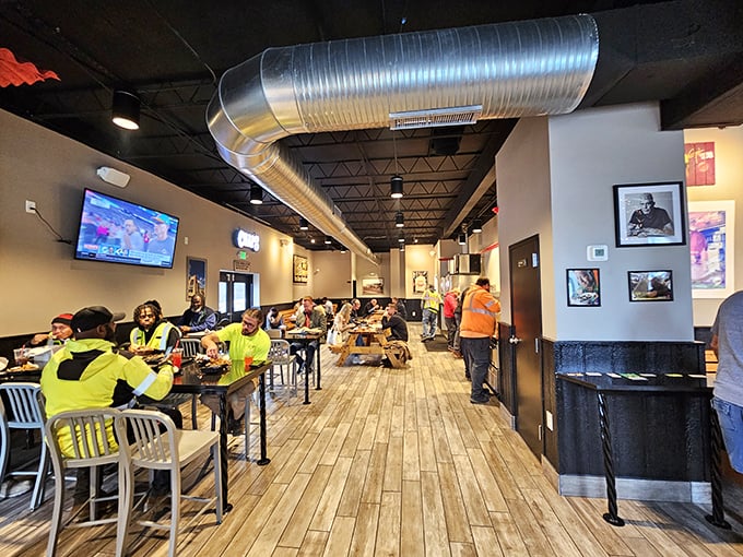 Where high-vis work vests meet world-class barbecue. This diverse crowd of diners shares one common language: appreciative silence while chewing.