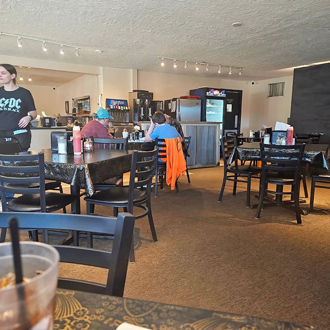 Local diners enjoying their meals, creating the kind of authentic atmosphere chain restaurants can only dream about.