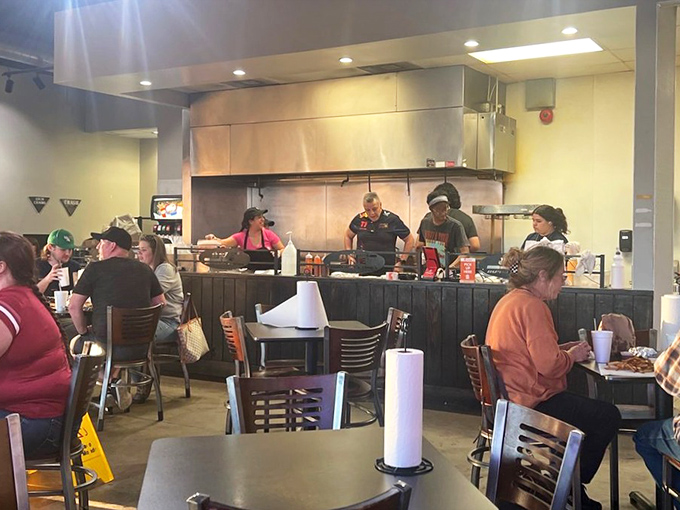The open kitchen theater – where burger artisans perform their craft while hungry audiences await the final act: the first bite.