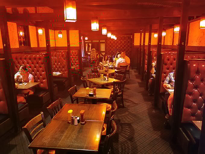 Every table tells a story of memorable meals shared – the restaurant's distinctive red glow makes everyone look like they're having the time of their lives.