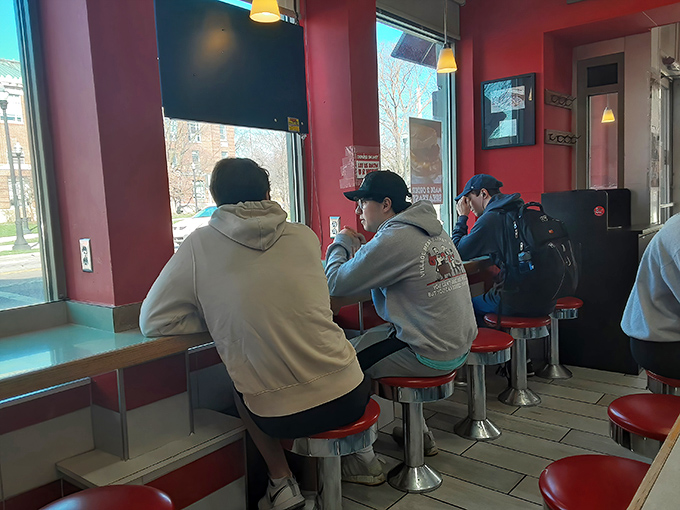 Where friendships are forged and stories are shared – students finding community one red stool and donut at a time.