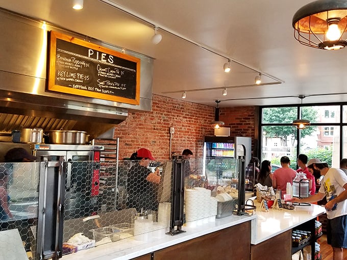 The chalkboard menu promises pies that could make your grandmother nervously adjust her recipe cards.