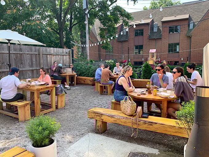 The outdoor patio—where strangers become friends over shared breakfast enthusiasm and the universal language of "mmm."