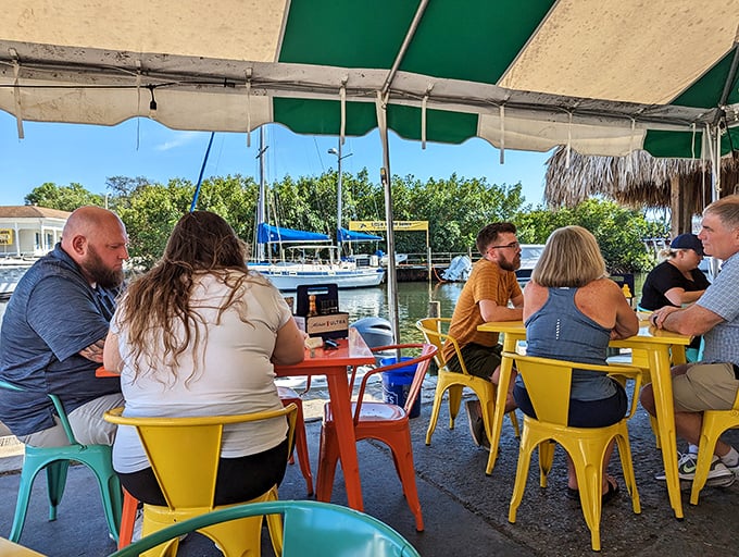 Waterfront dining where boats drift by and conversations flow as easily as the water beneath the docks.