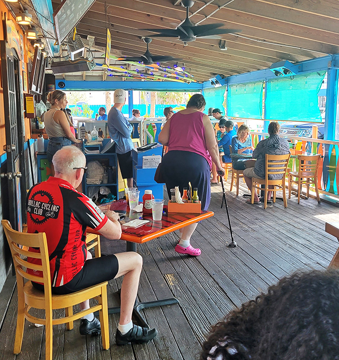 A full house of happy diners—the universal language of "mmm" transcends all barriers when grouper this good is involved.