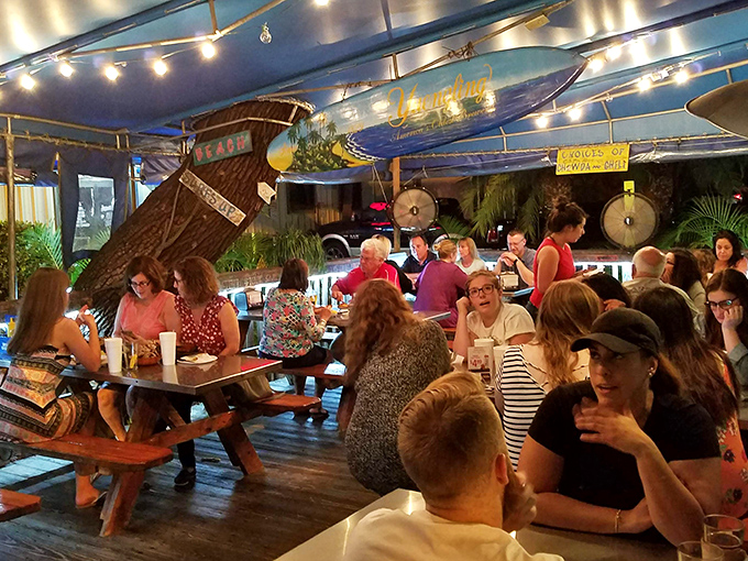 Where strangers become friends over shared tables and seafood platters. The true Florida social club has wooden benches.