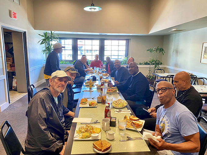 The breakfast club in session—where friendships are fortified over forkfuls of fluffy pancakes and endless coffee refills.