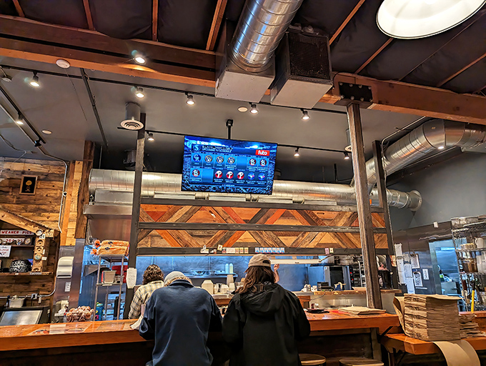 The counter seating offers front-row tickets to the culinary show. These diners know they've found something special in Portland's chicken scene.