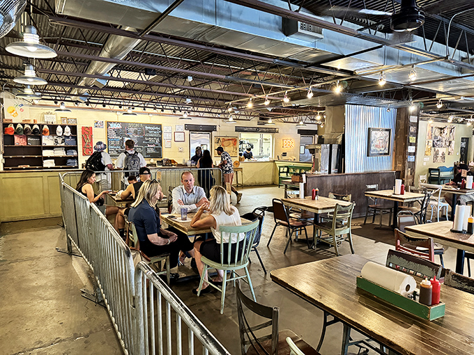 The happiest people in Dallas might just be these diners, caught in that magical moment between ordering and the first heavenly bite.