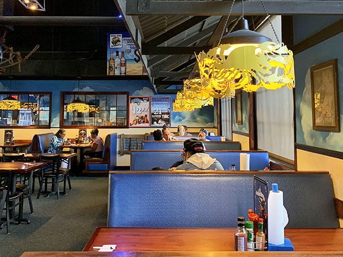 The blue booth seating isn't just comfortable—it's the perfect vantage point for plotting your strategy through the menu's treasures.