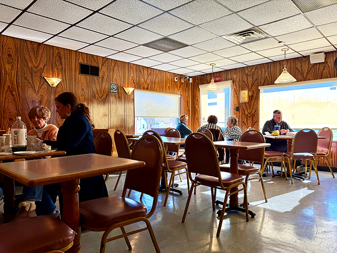 Diners bask in the warm glow of wood-paneled walls, creating the kind of atmosphere money can't buy but time can perfect.