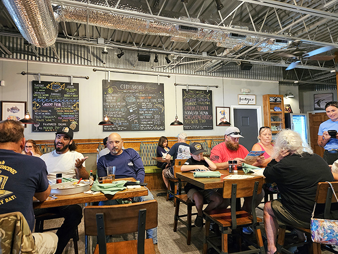 The chalkboard specials and wooden tables create that perfect neighborhood vibe where strangers become friends over shared seafood platters.